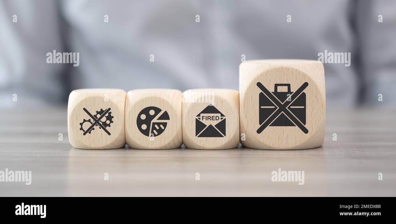 Wooden blocks with symbol of job loss concept Stock Photo - Alamy