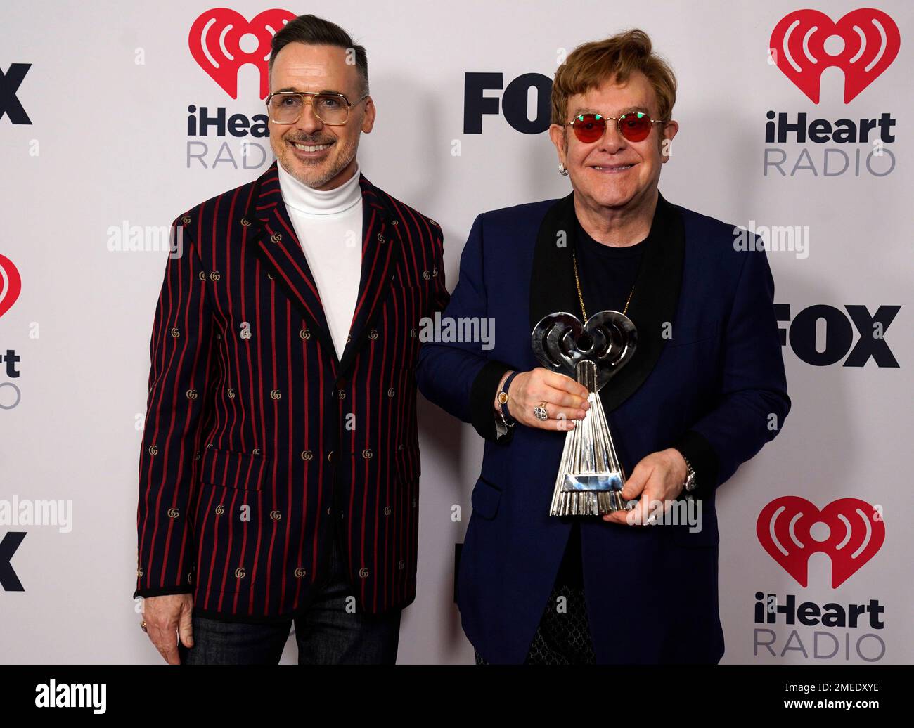 Icon award winner Elton John, right, and David Furnish attend the ...