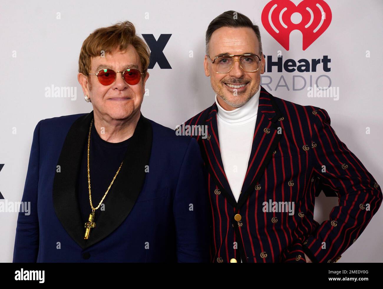 Icon award winner Elton John, left, and David Furnish attend the ...