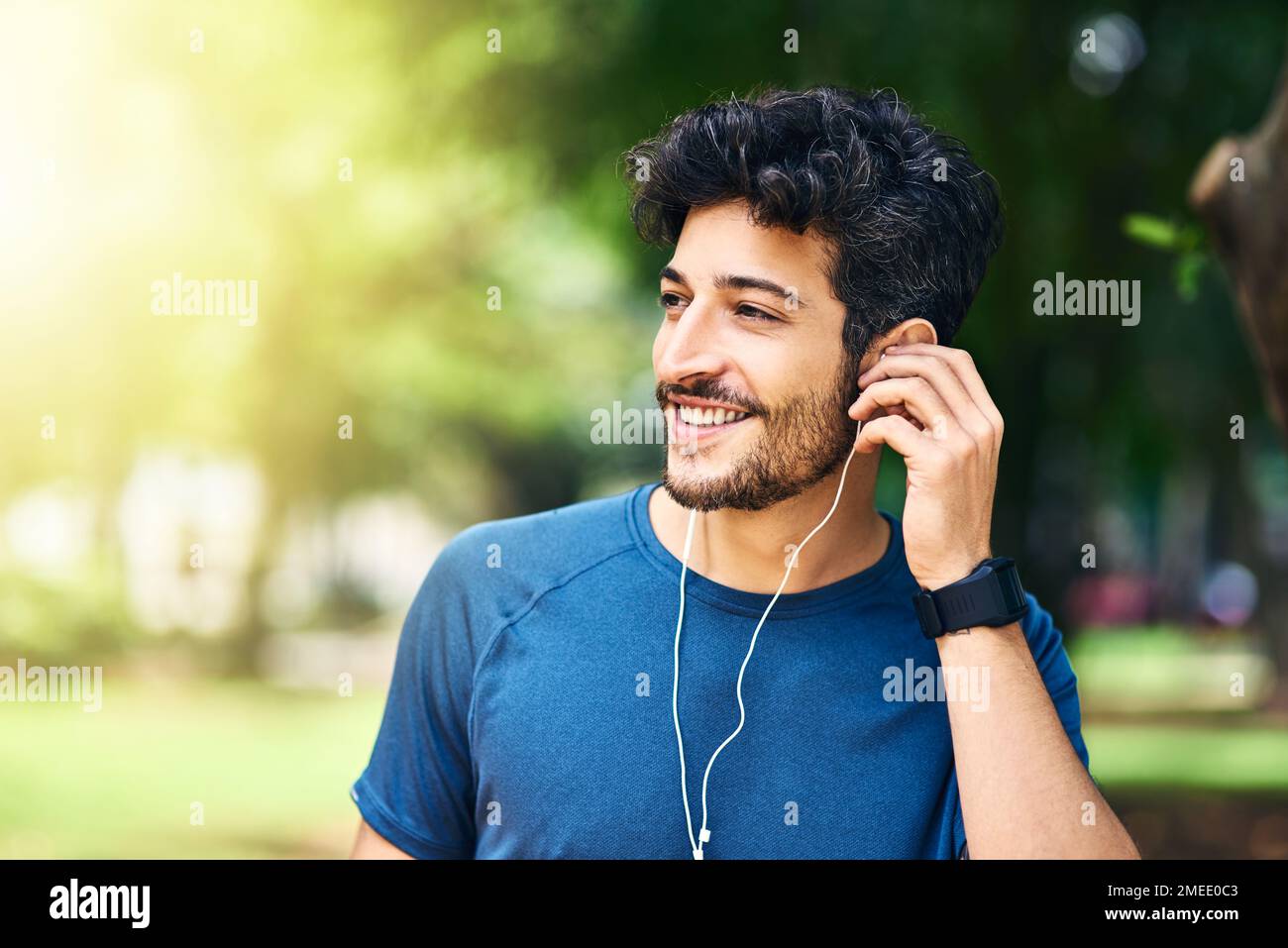 Some music to adjust the mind into workout mode. a sporty young man ...