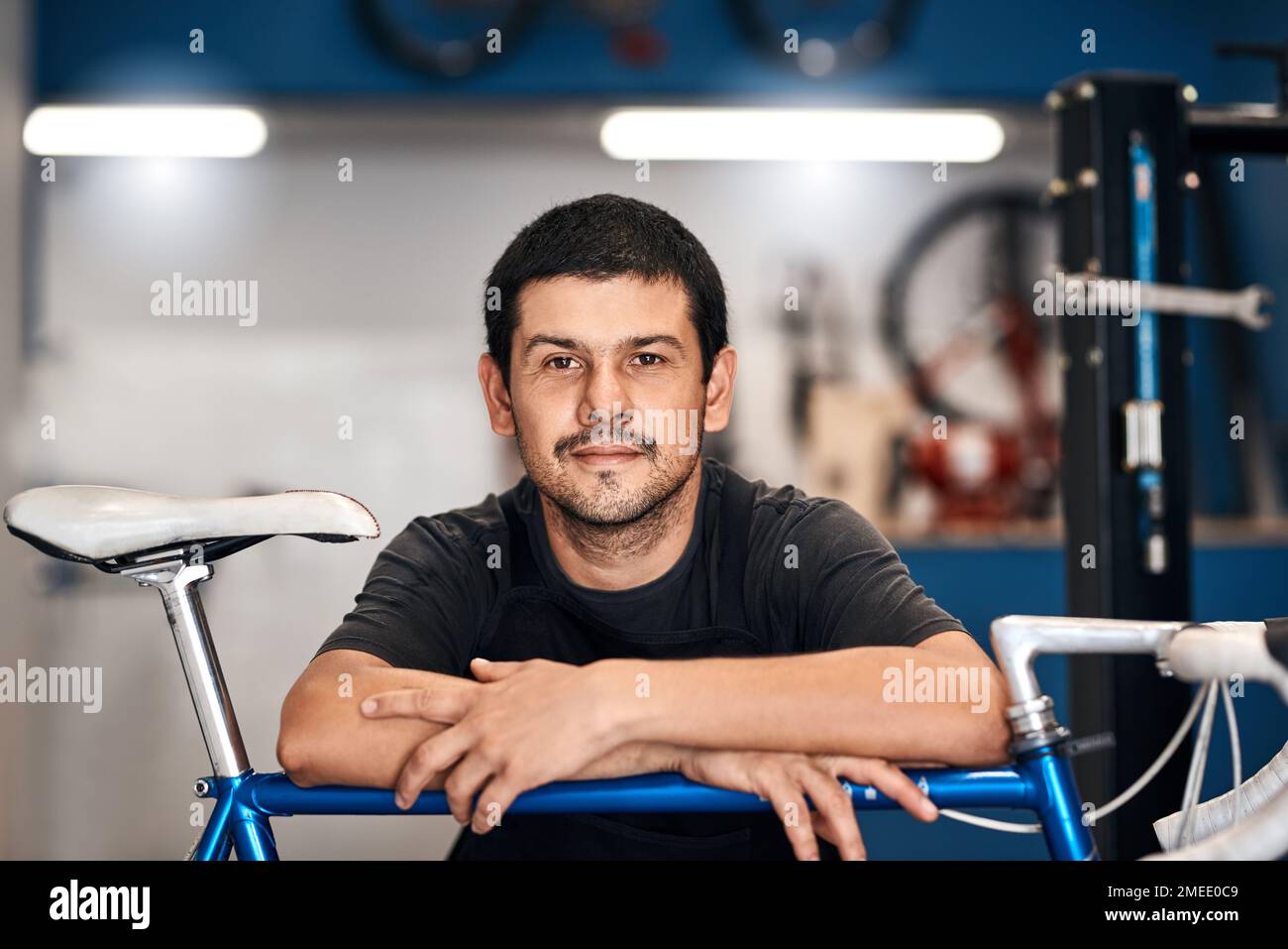 Lets get your bicycle up and running again. a man working in a bicycle ...