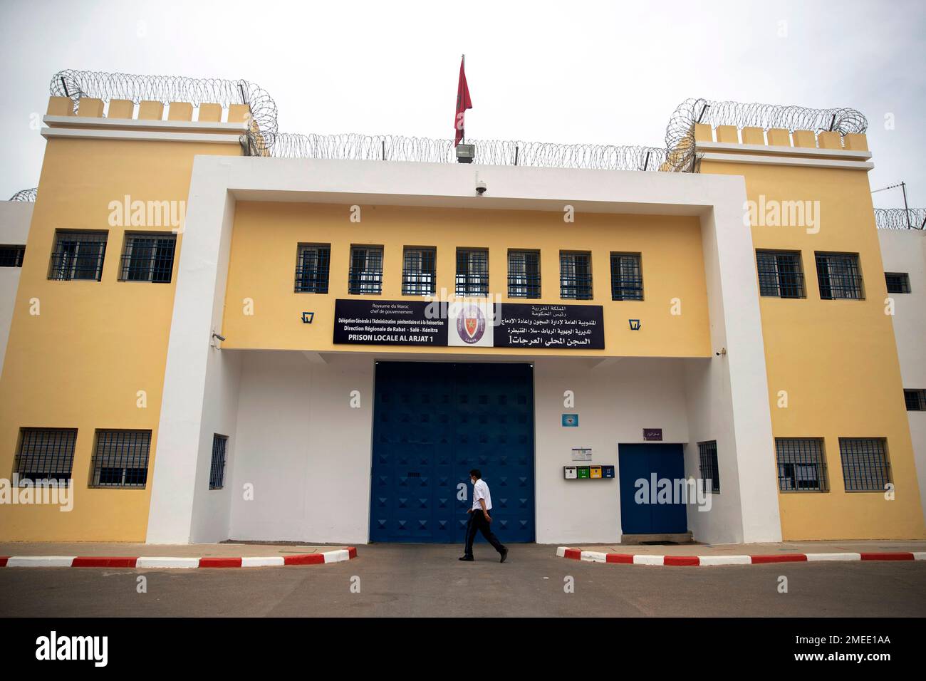 A security guard walks outside the gates of the Arjat prison on the ...