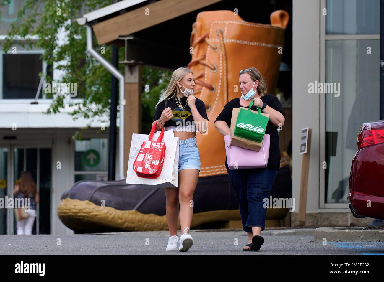 Shoppers walk past a giant LL Bean boot outside the Ross Park Mall in ...