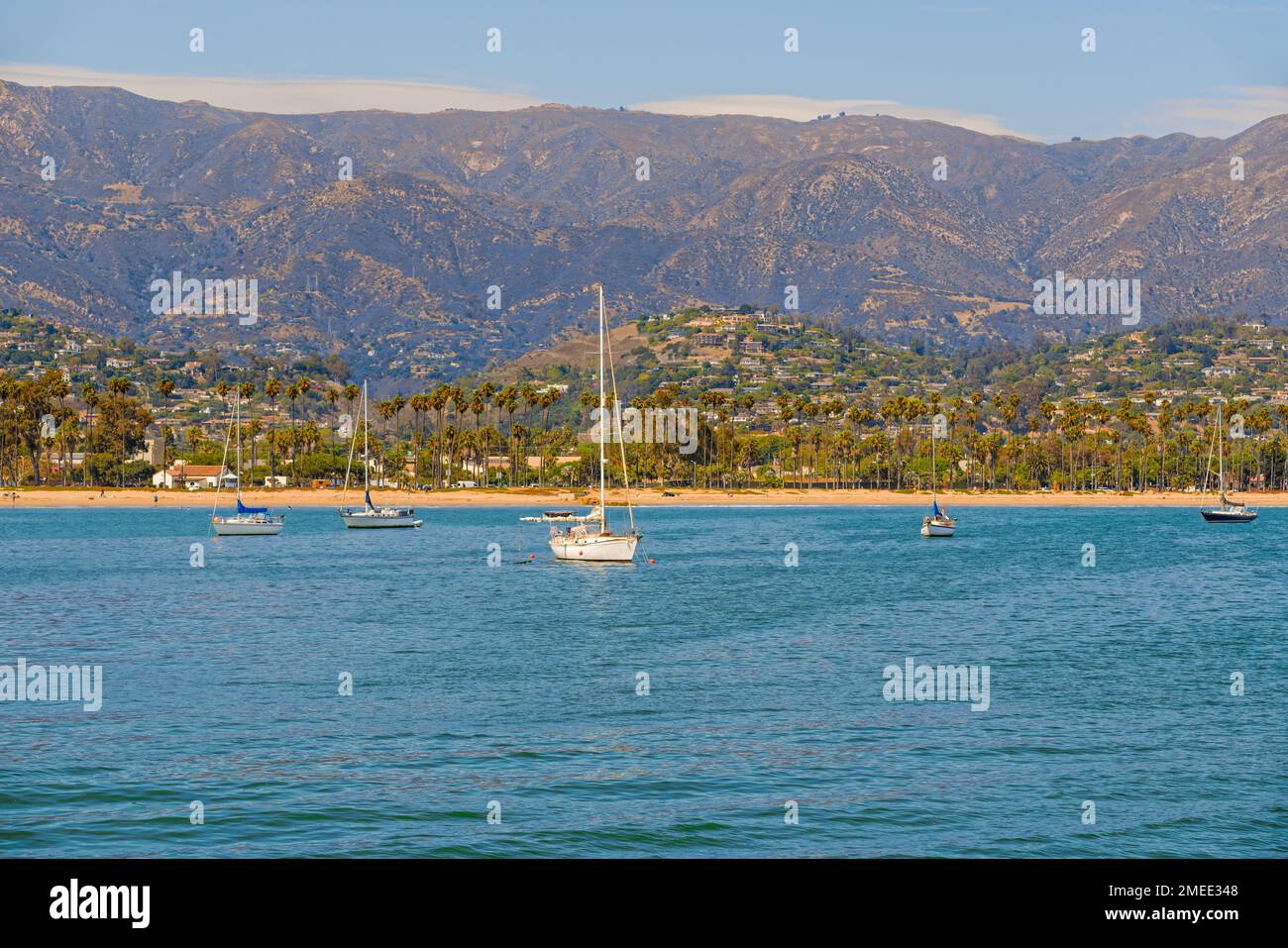 Santa Barbara harbor, California. Boat on a water, beautiful beach with ...