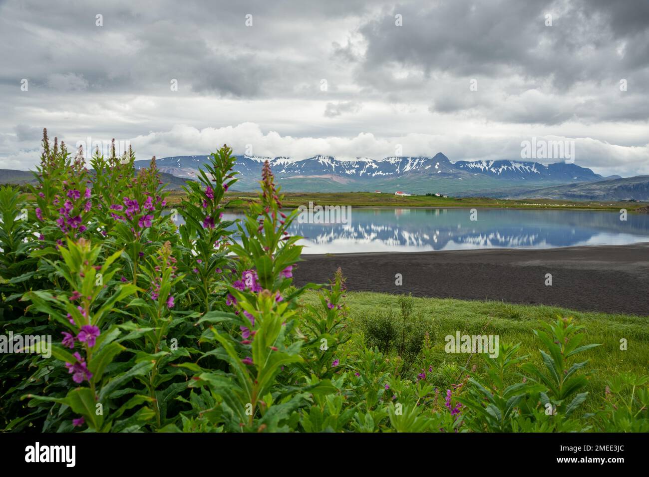 Reflections of mountains in a lake close to Fossatun in Iceland Stock Photo - Alamy