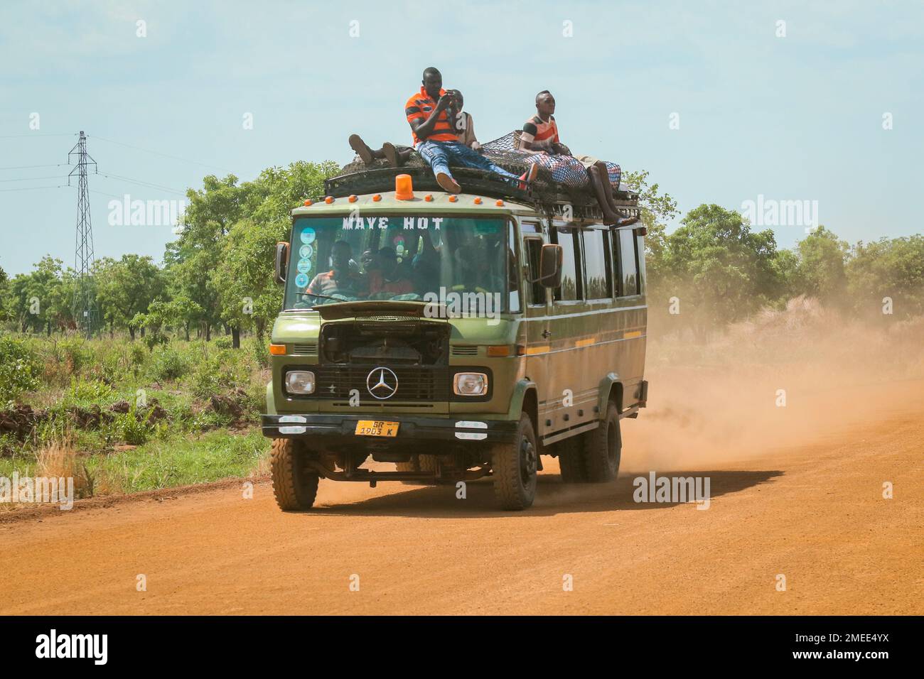 Crowded African Public Bus with the Bags on the Dusty Road in the heart of Ghana Stock Photo - Alamy
