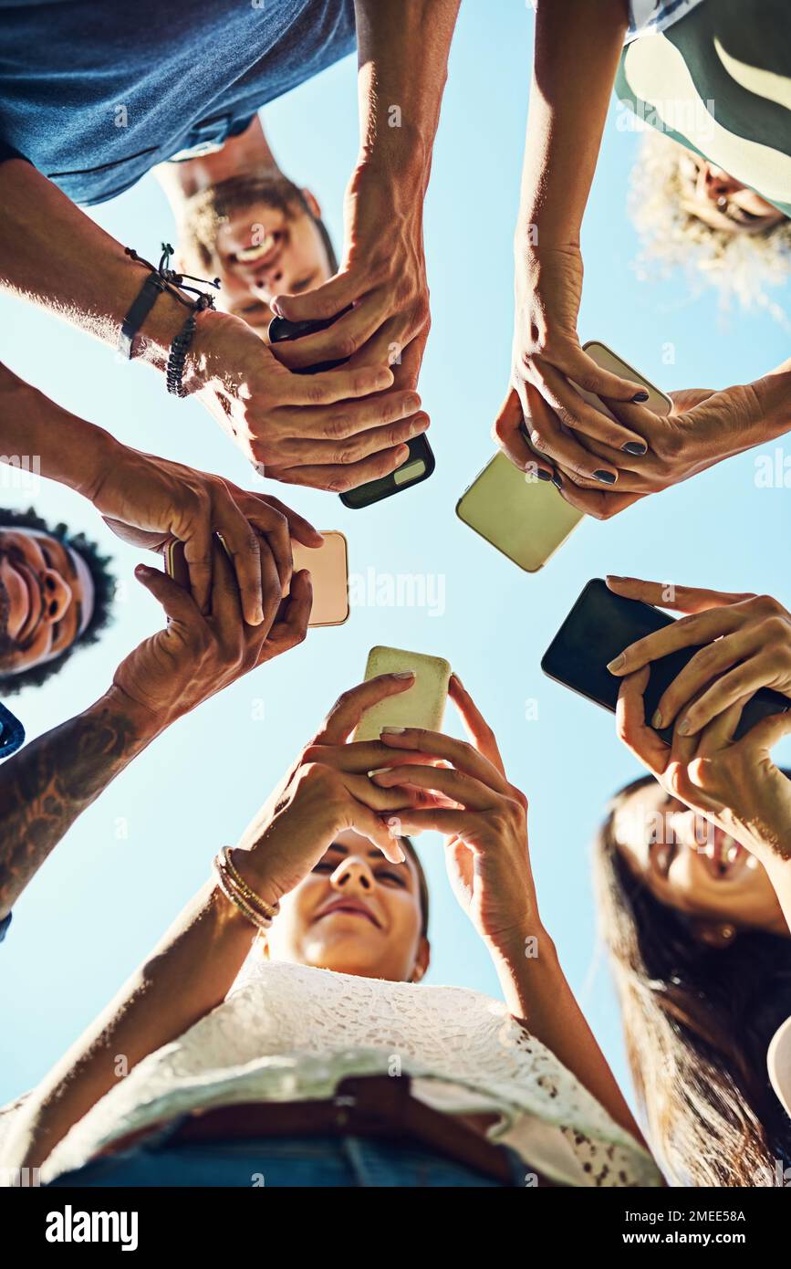 Getting their social connections together. a group of people using ...