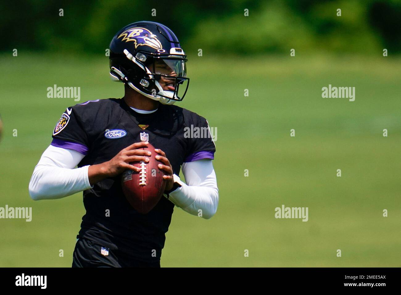 Baltimore Ravens quarterback Kenji Bahar works out during the team's ...
