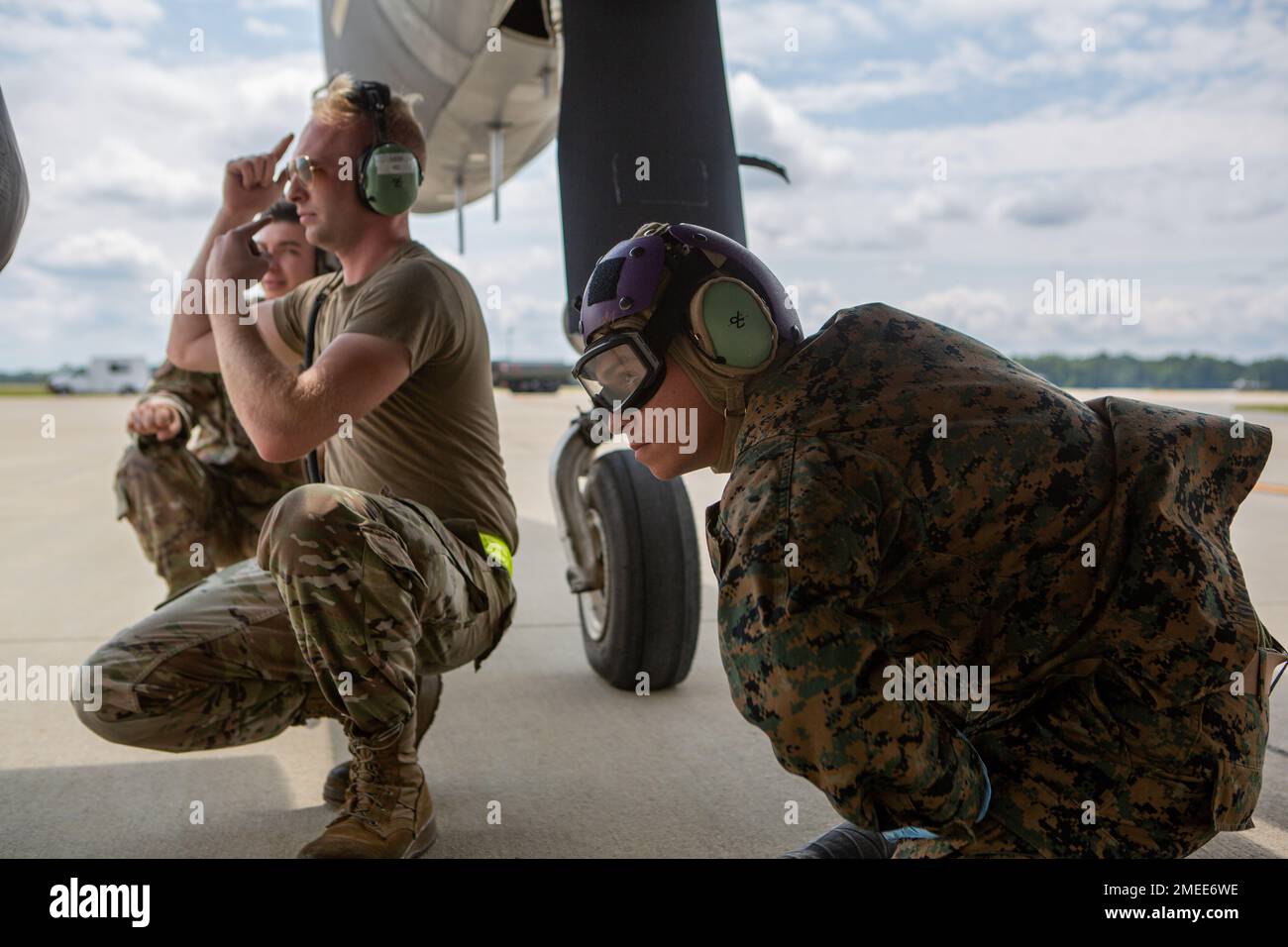 U.S. Marine Corps Cpl. Nathan Bell (right), a bulk-fuel specialist with ...