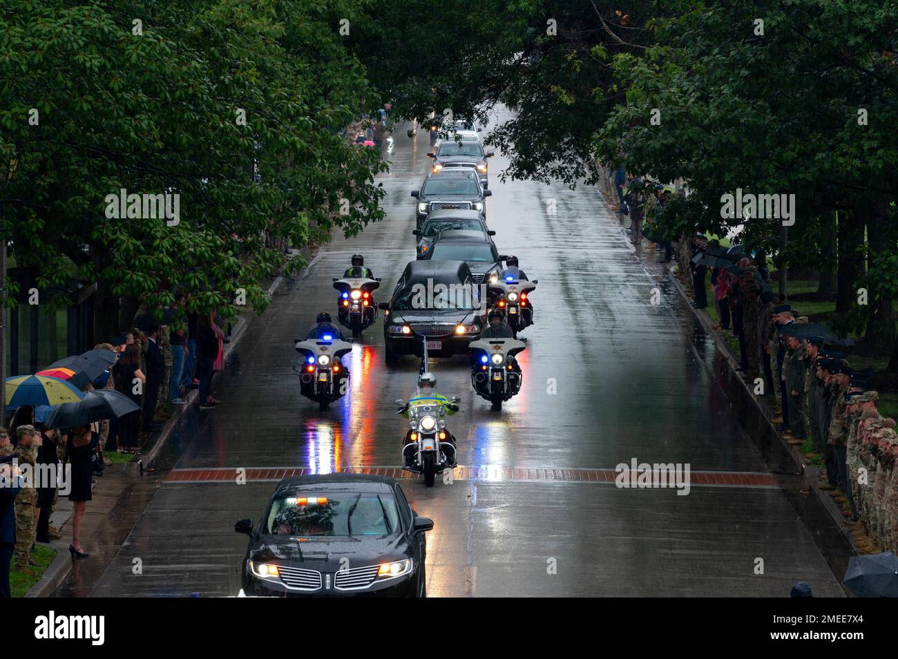 Friends and family line the street to pay respect to Col. Zachary Hall ...