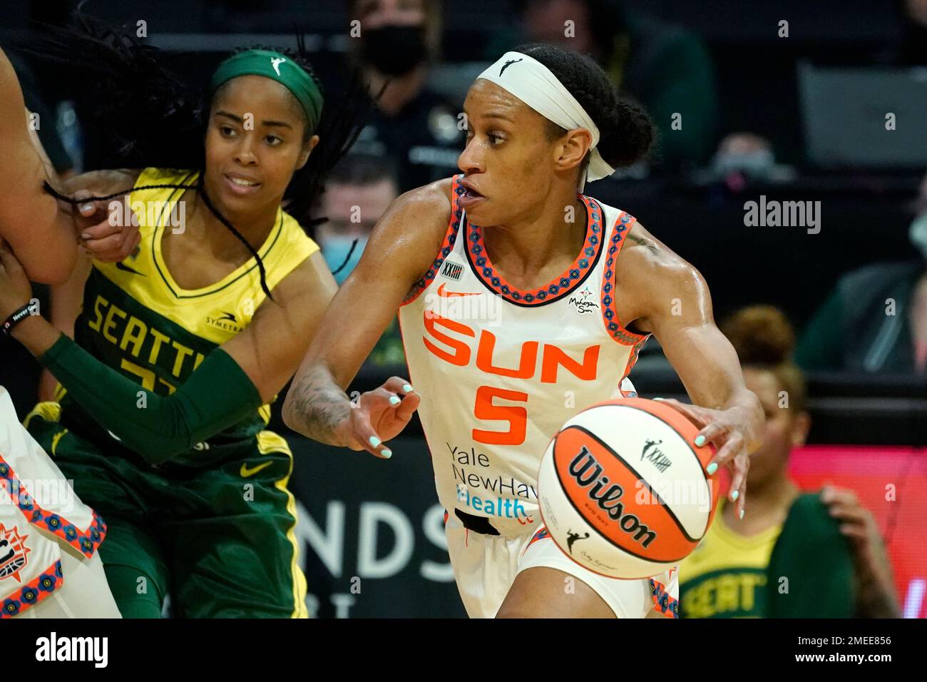 Connecticut Sun's Jasmine Thomas (5) tries drives as Seattle Storm's ...