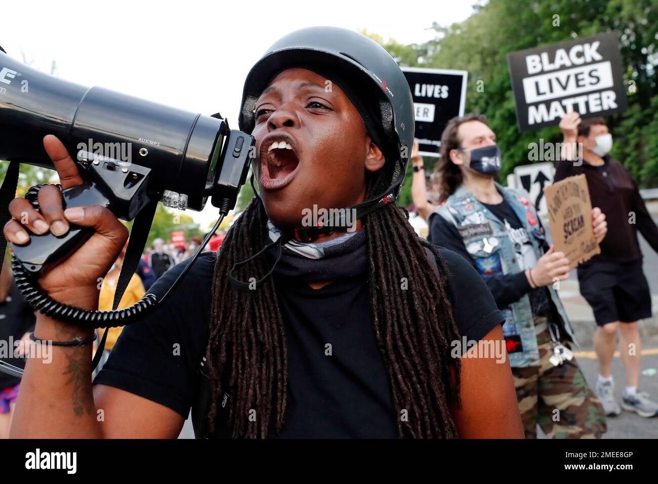 Moblie Burrell marches during a racial justice rally on the one year ...