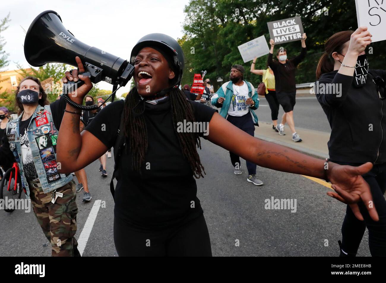 Moblie Burrell marches during a racial justice rally on the one year ...