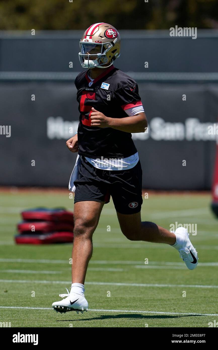 San Francisco 49ers quarterback Trey Lance jogs on the field at the ...