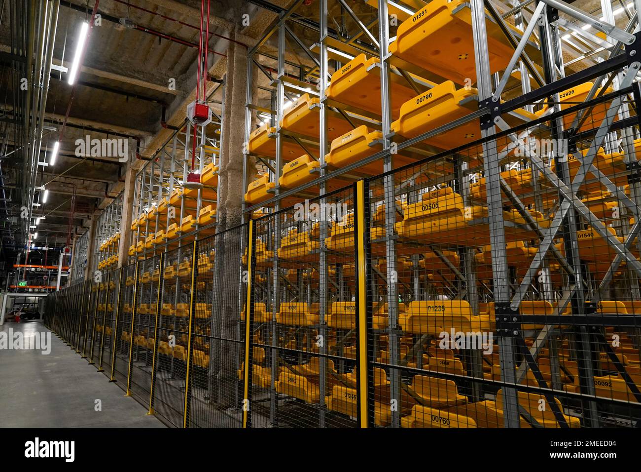 An automated storage and retrieval baggage handling system uses plastic ...