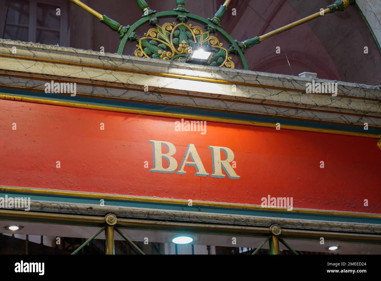 bar french vintage sign text on retro facade wall pub in city street ...