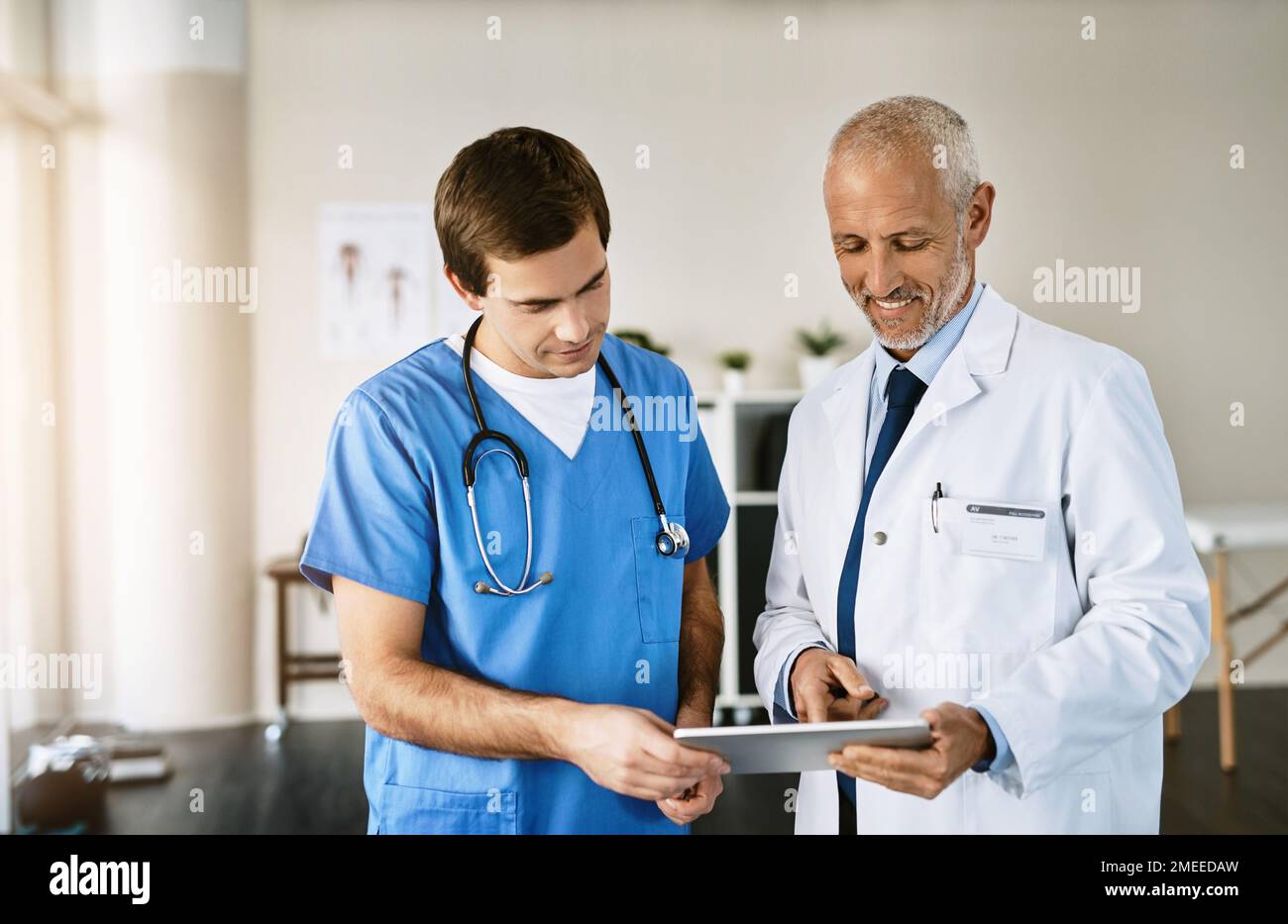 Making smart decisions with smart tech. two medical practitioners using ...
