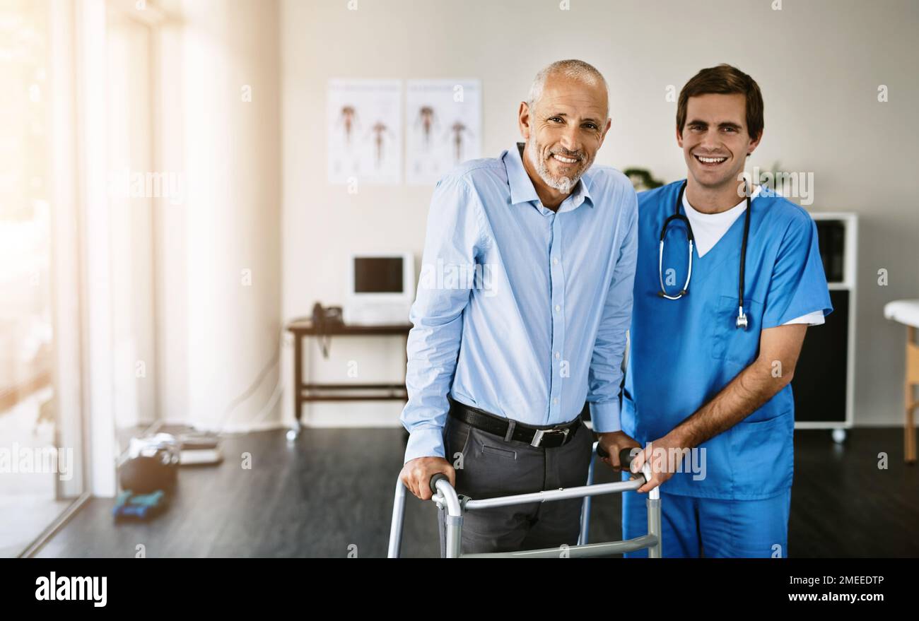 He got me to my feet again. Portrait of a male nurse assisting a senior ...