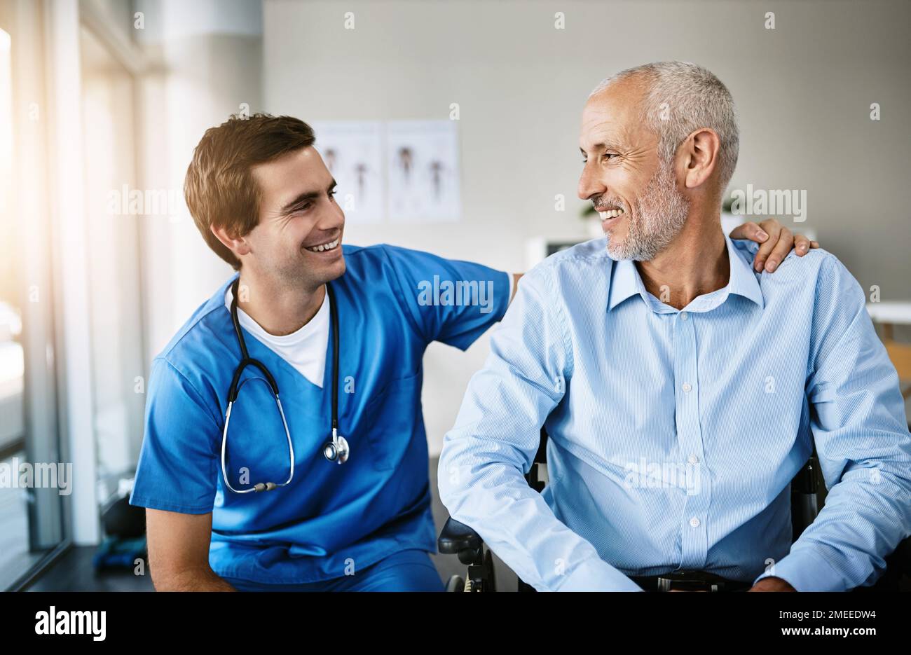 Youve got my absolute support. a male nurse caring for a senior patient ...