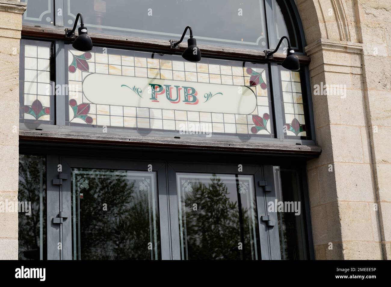 pub sign text on facade entrance bar city street storefront building ...