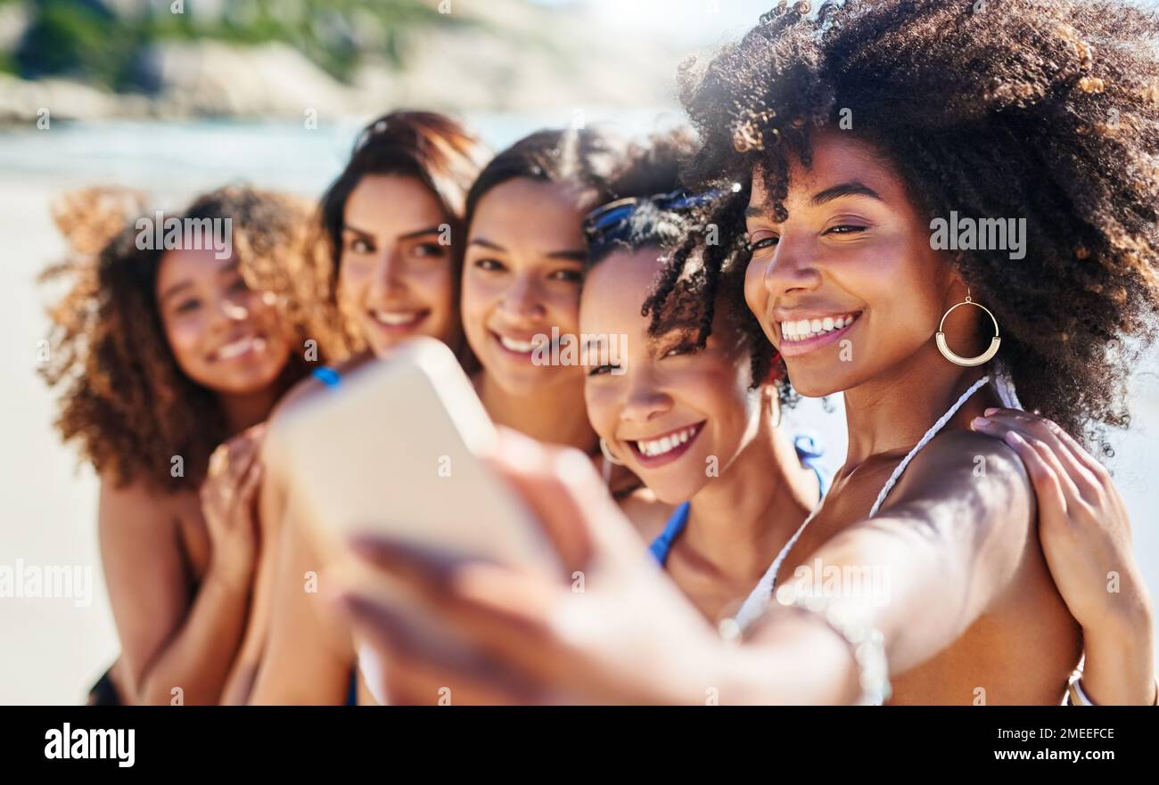 Beach days with the besties. a group of happy young women taking ...