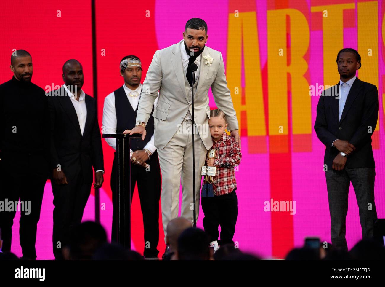 Friends and family look on as Drake accepts the artist of the decade ...