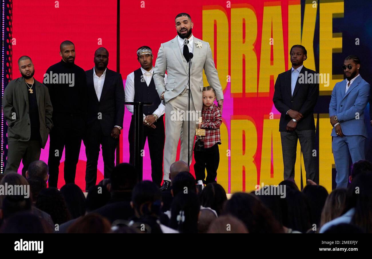 Friends and family look on as Drake accepts the artist of the decade ...