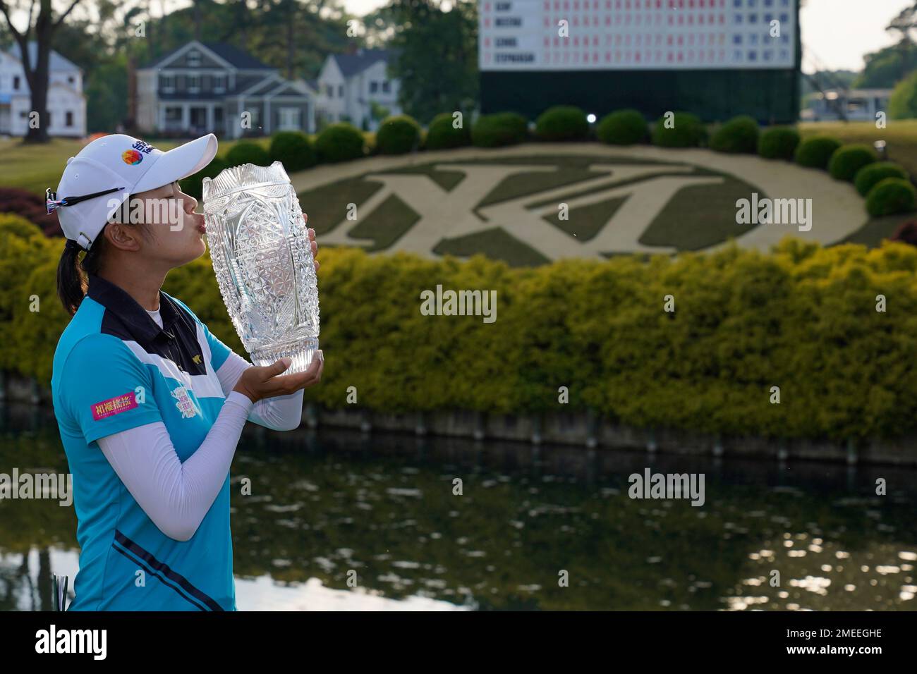 Wei-Ling Hsu, of Taiwan, kisses the winners trophy as she celebrates ...