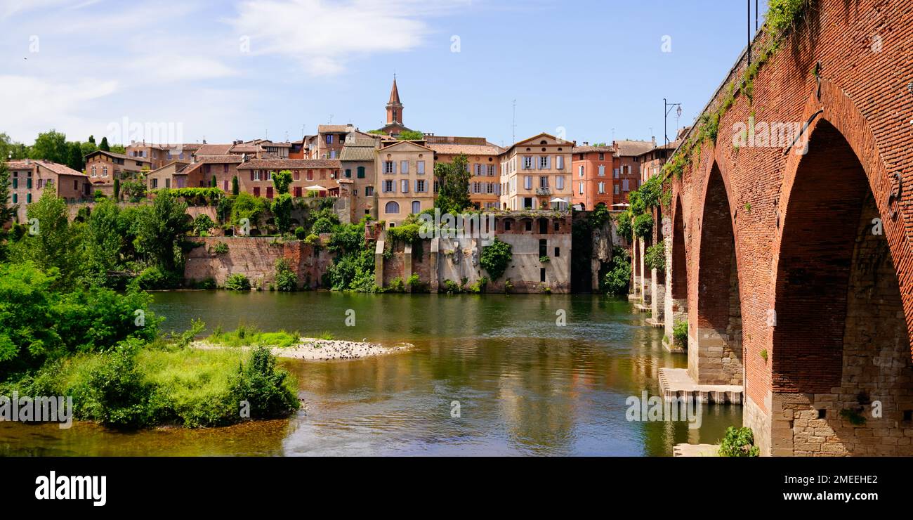 Albi view city and old red brick stone bridge over Tarn river in France ...