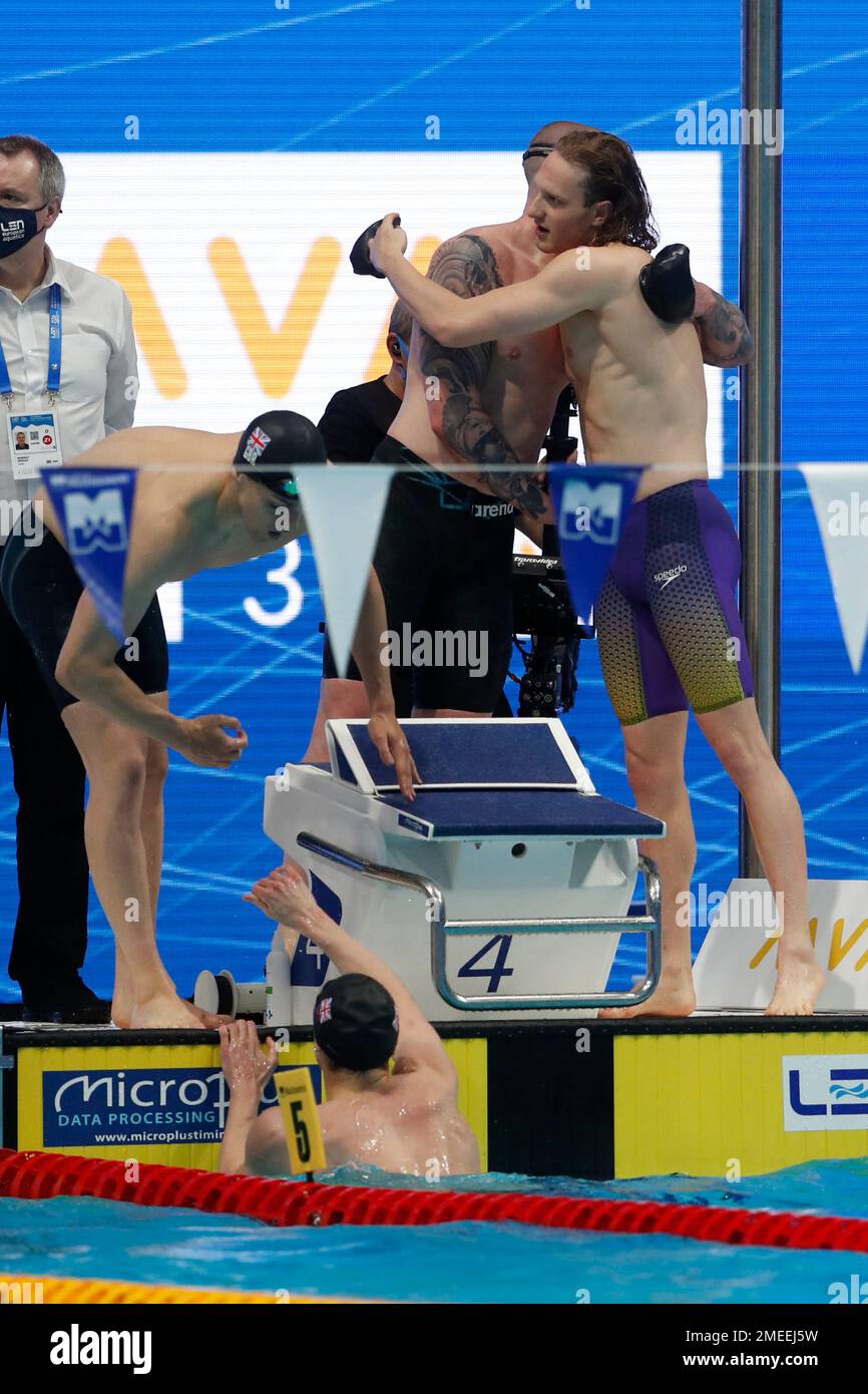 Britain's swimmers celebrate their victory in the 4 x 100m relay at the ...