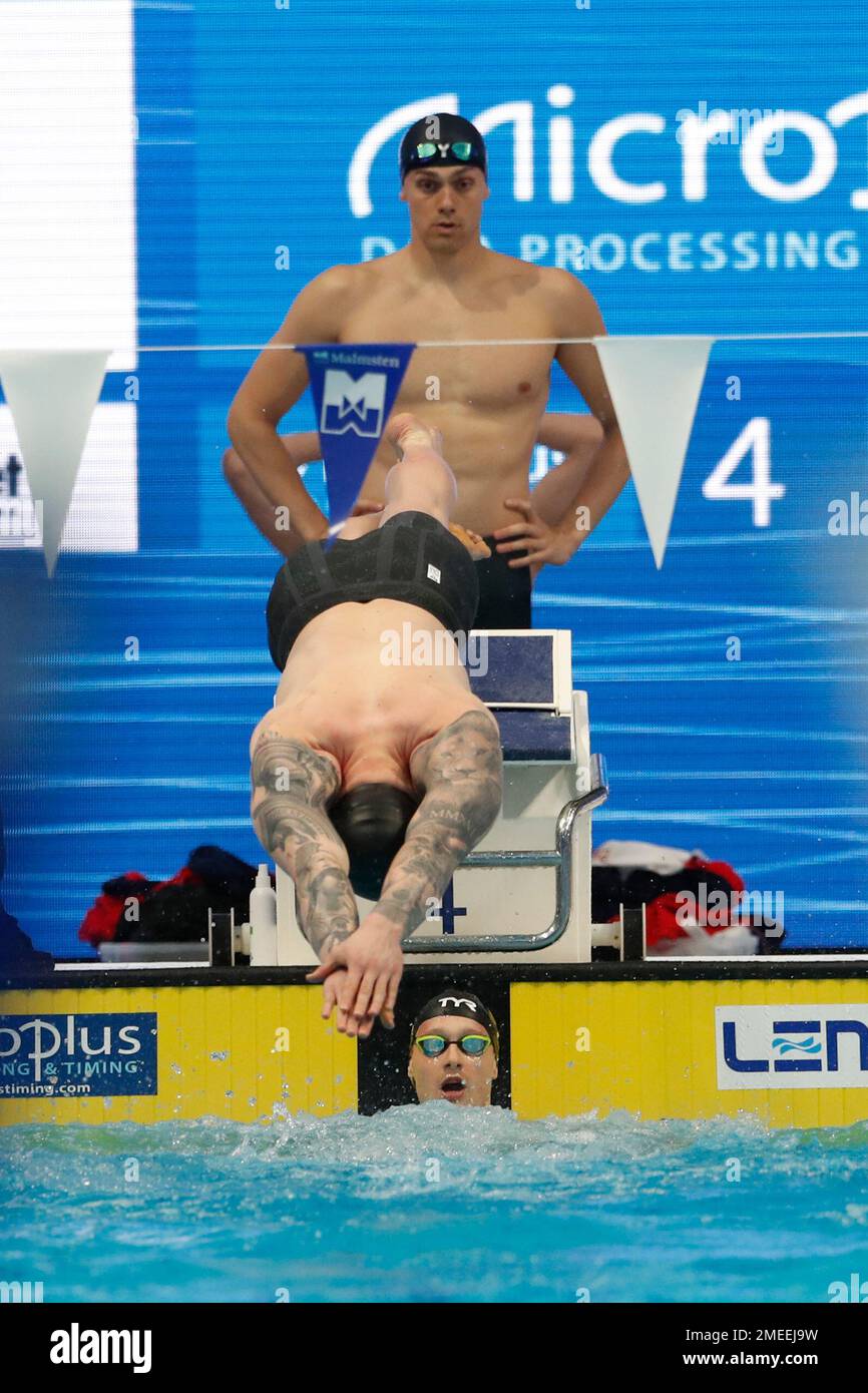 Britain's swimmers change over during the 4 x 100m relay at the ...