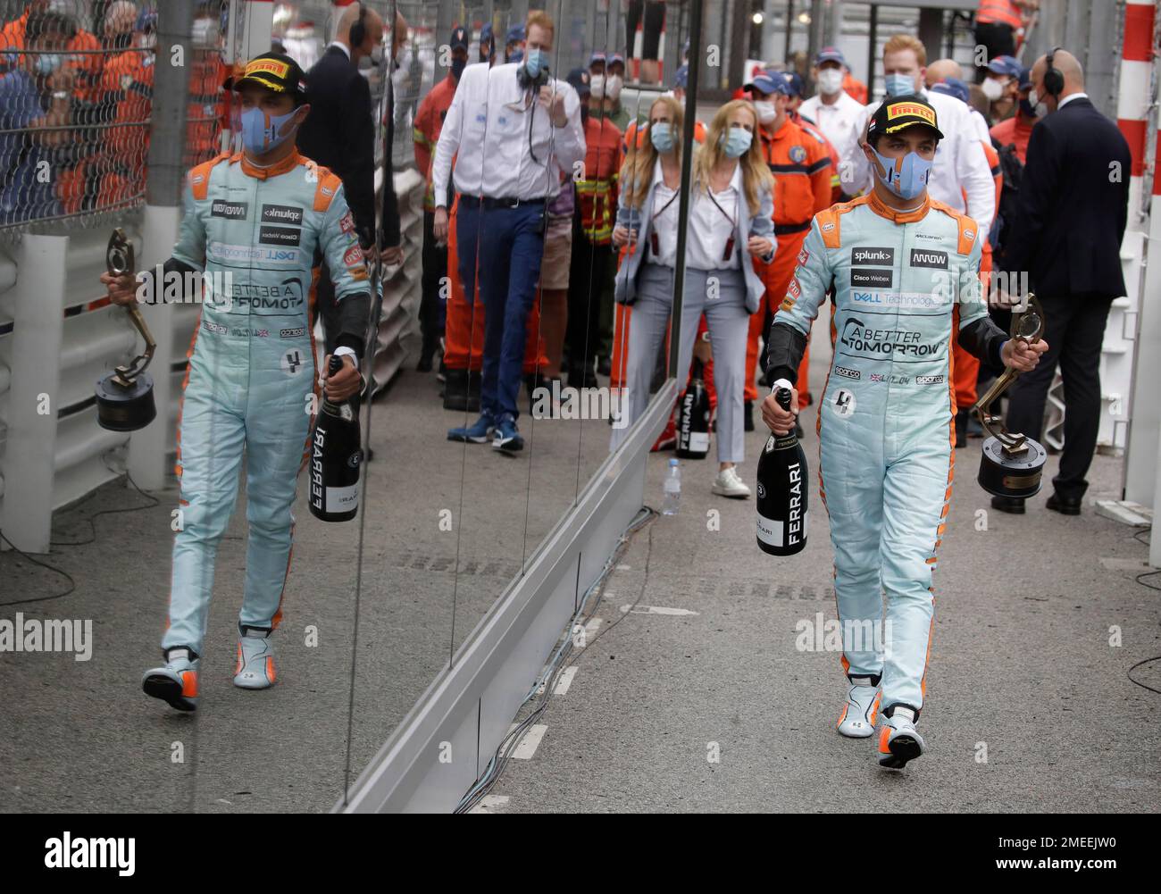 Mclaren driver Lando Norris of Britain walks with his trophy after ...