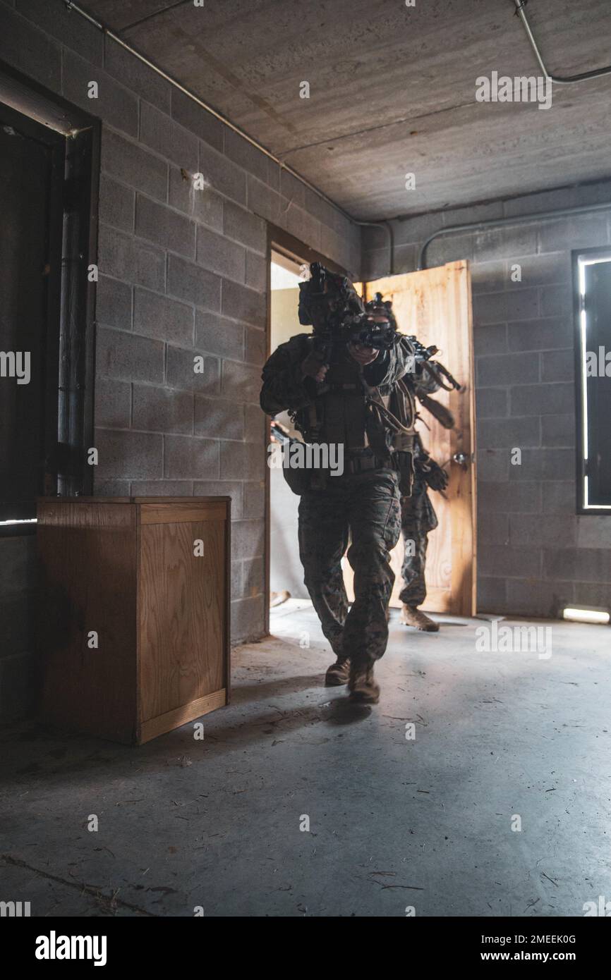 U.S. Marines with 1st Battalion, 8th Marine Regiment, 2d Marine Division, clear a building ...