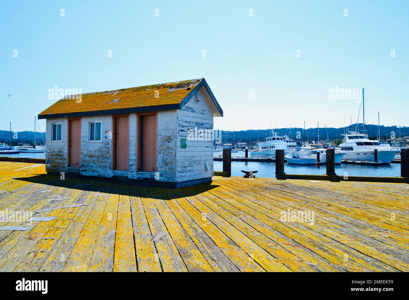little building with a yellow roof at the marina in Monterey Stock ...