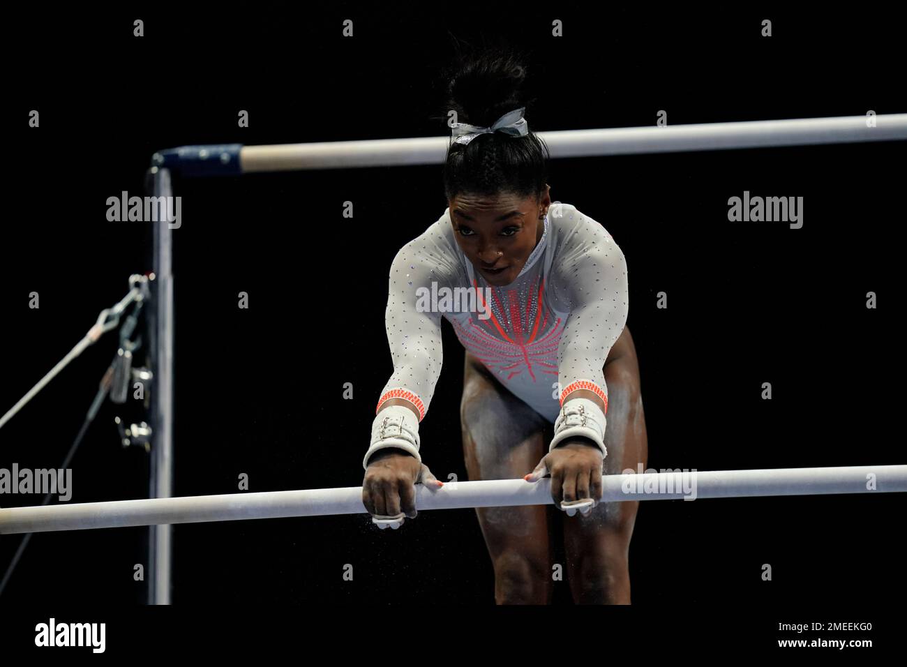 Simone Biles performs her routine on the uneven bars during the U.S ...