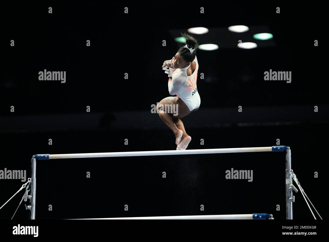 Simone Biles performs her routine on the uneven bars during the U.S ...