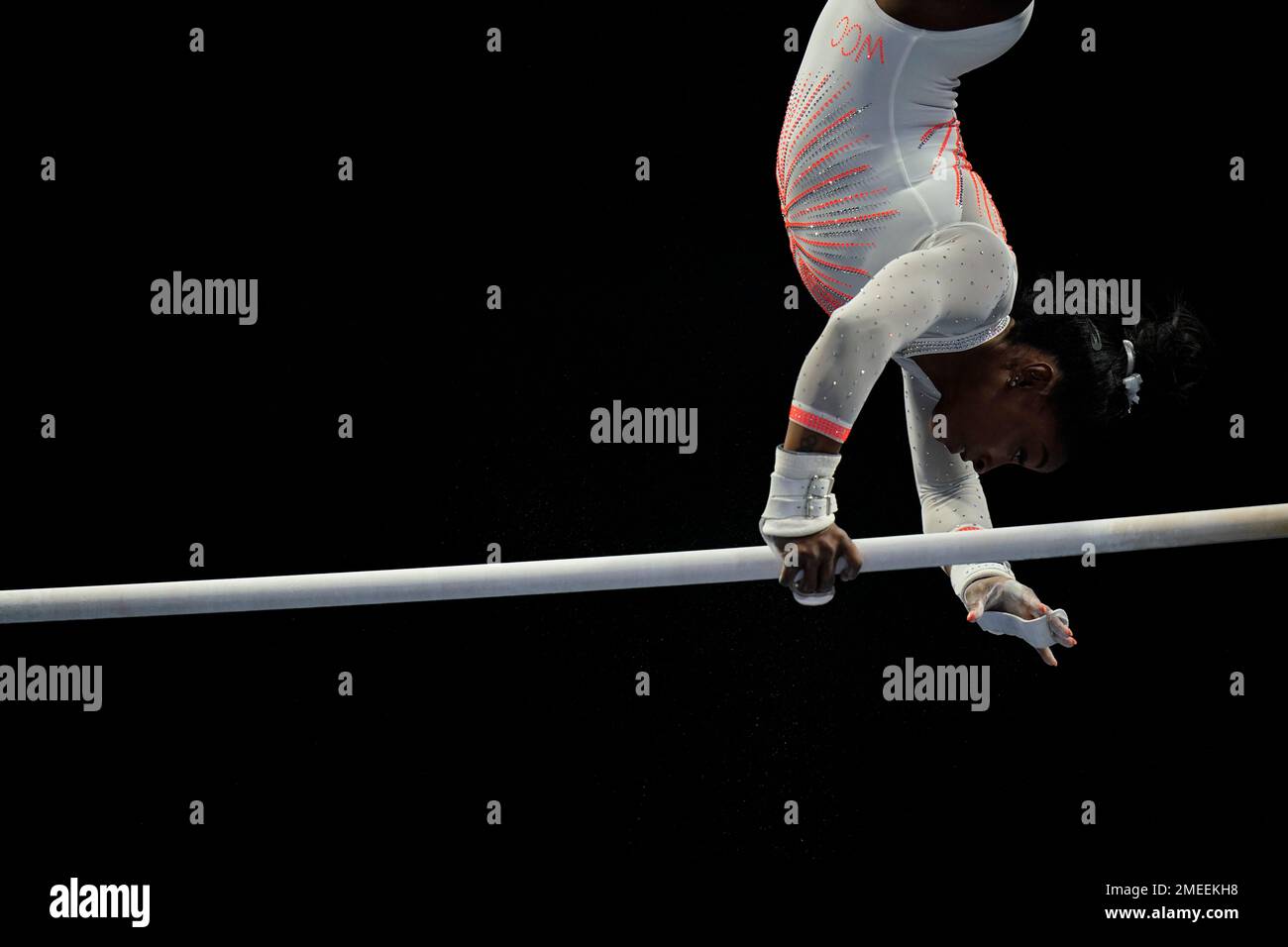 Simone Biles wipes out during her routine on the uneven bars during the ...