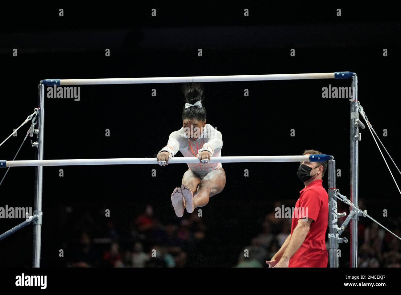 Simone Biles performs her routine on the uneven bars during the U.S ...