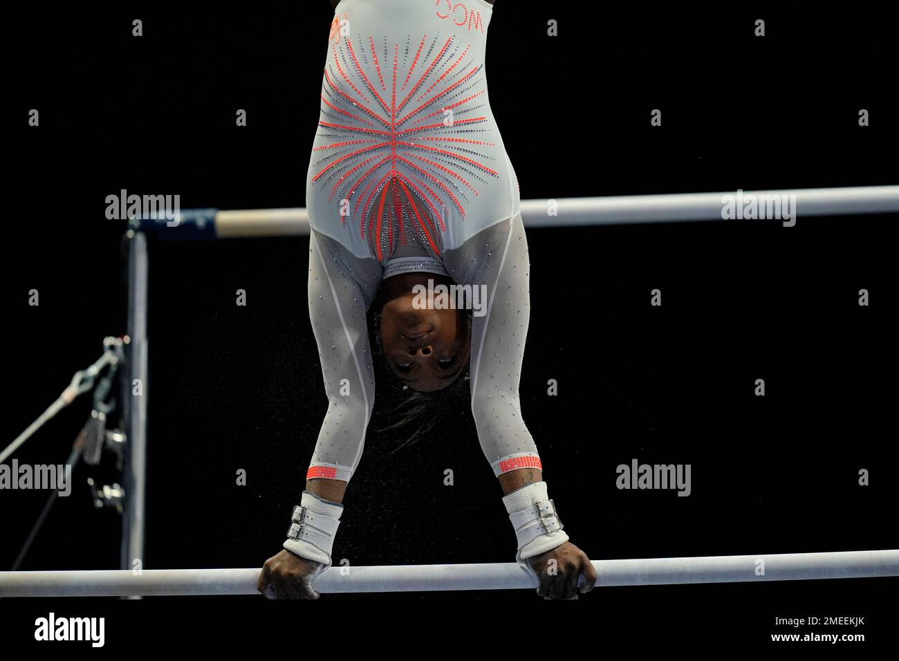Simone Biles performs her routine on the uneven bars during the U.S ...
