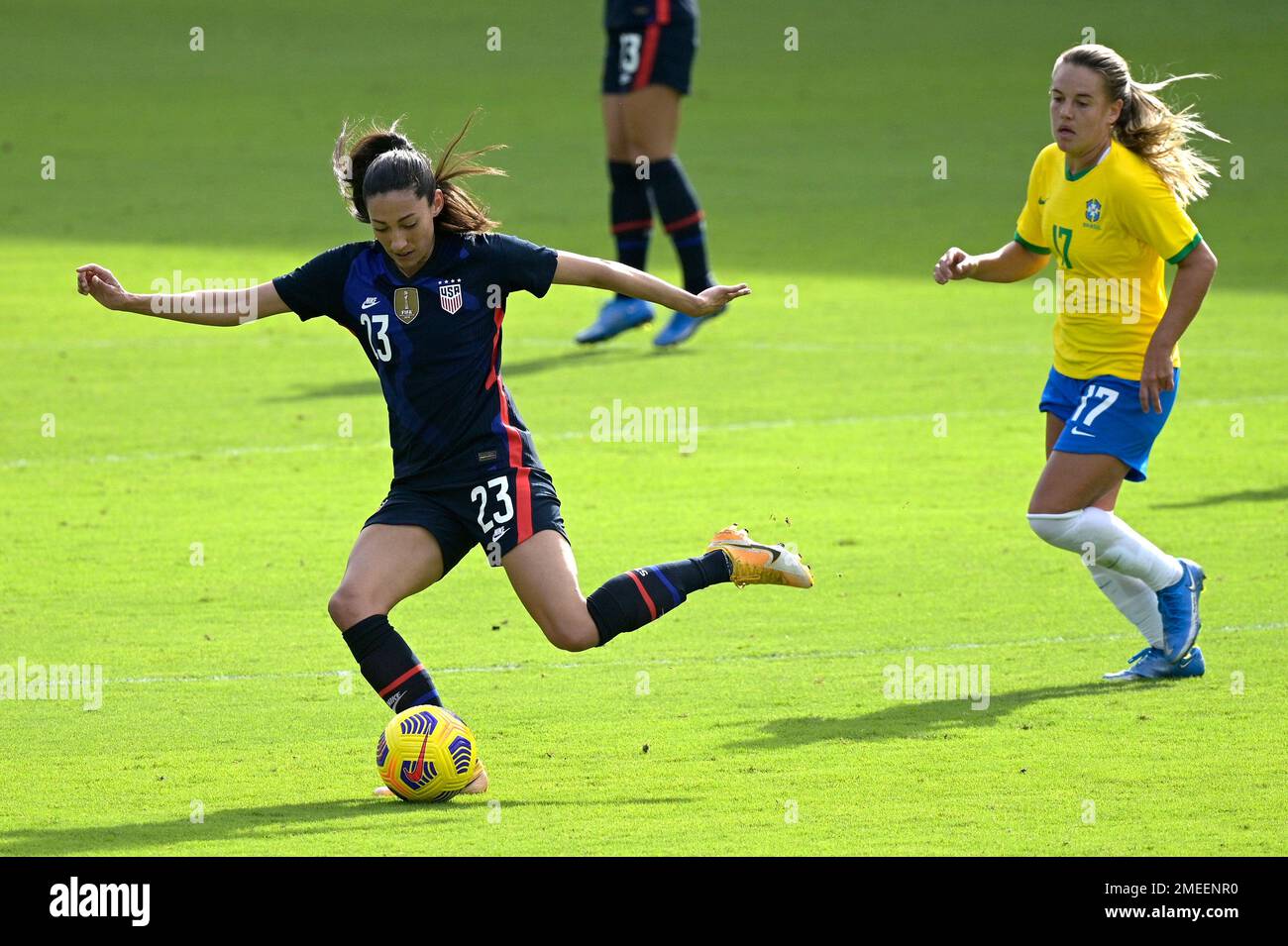 United States forward Alex Morgan (13) kicks a ball in front of Brazil ...