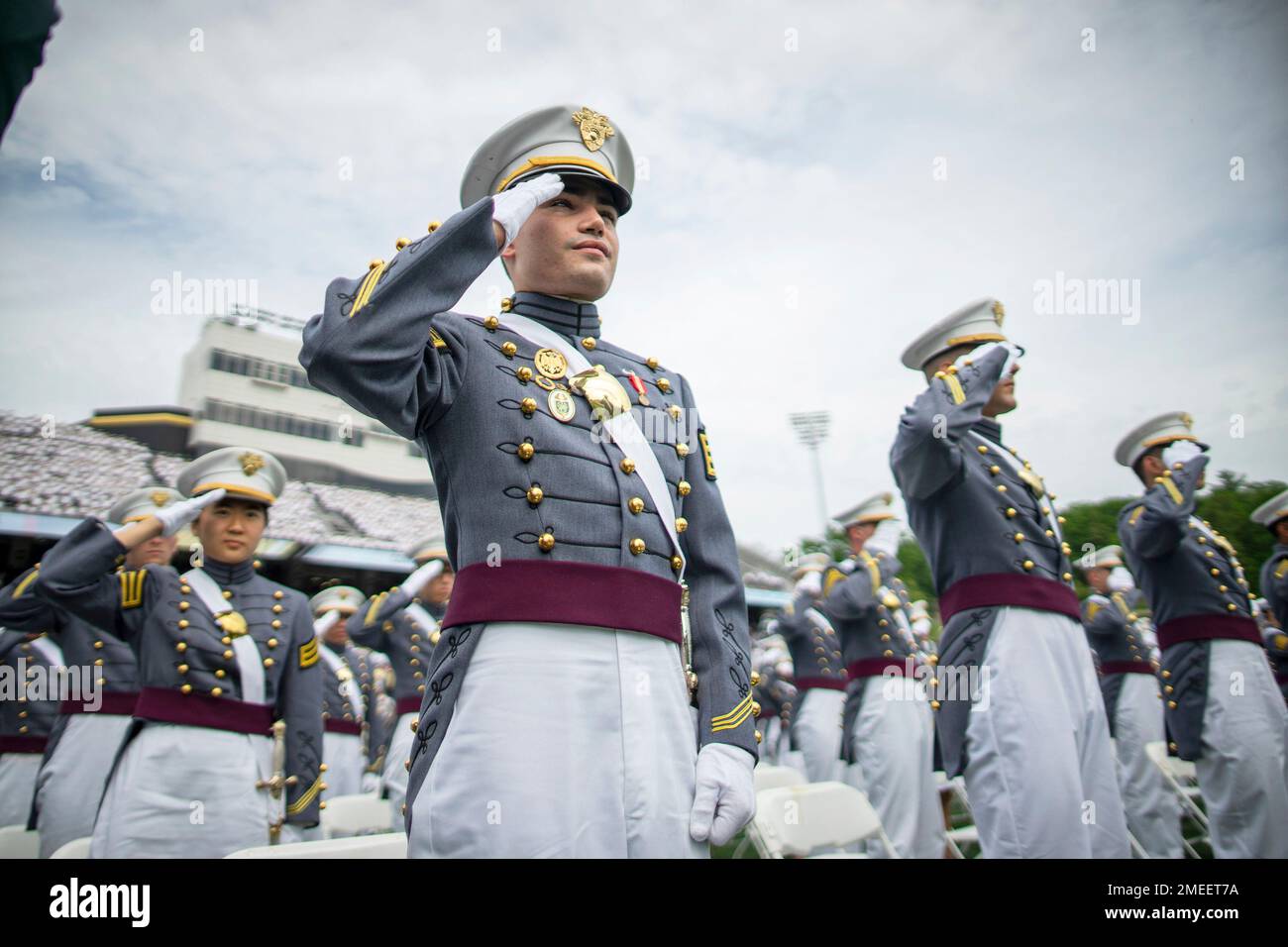 United States Military Academy graduating cadets salute during their ...
