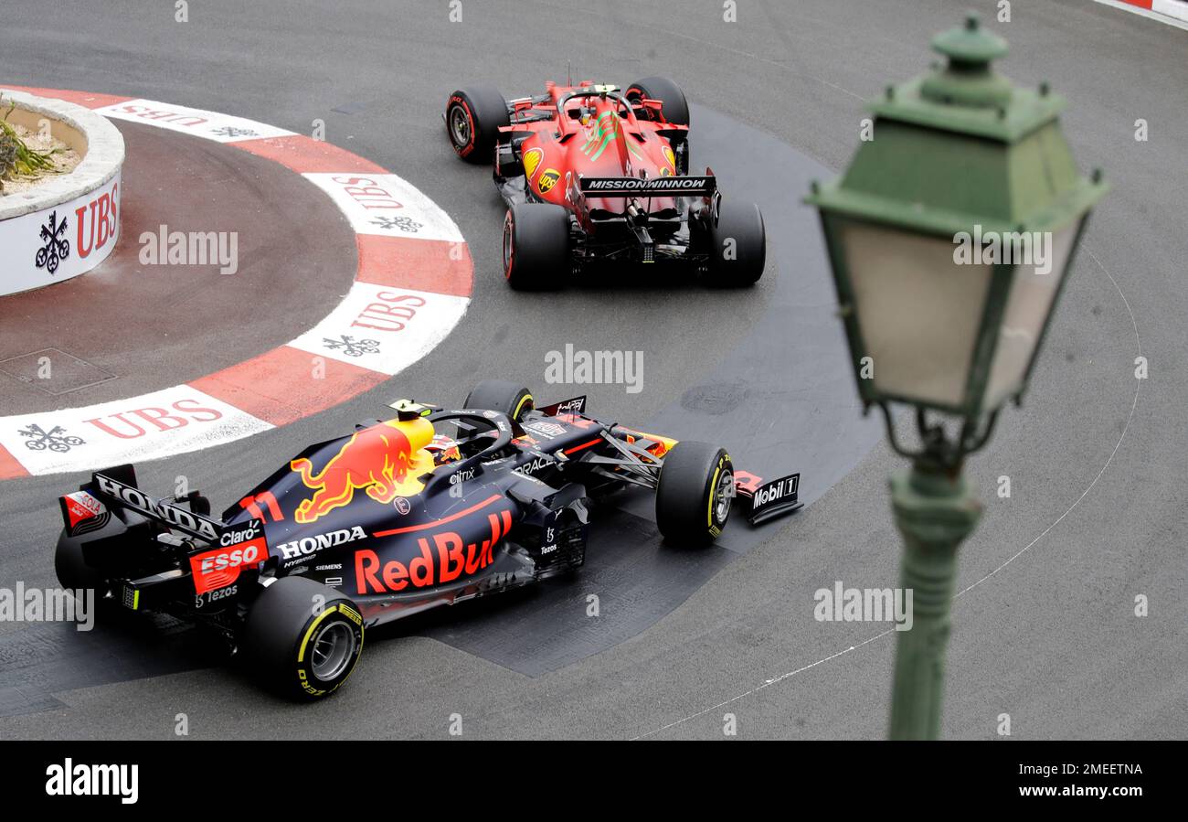 Red Bull driver Sergio Perez of Mexico, left, steers his car during the third free practice for ...
