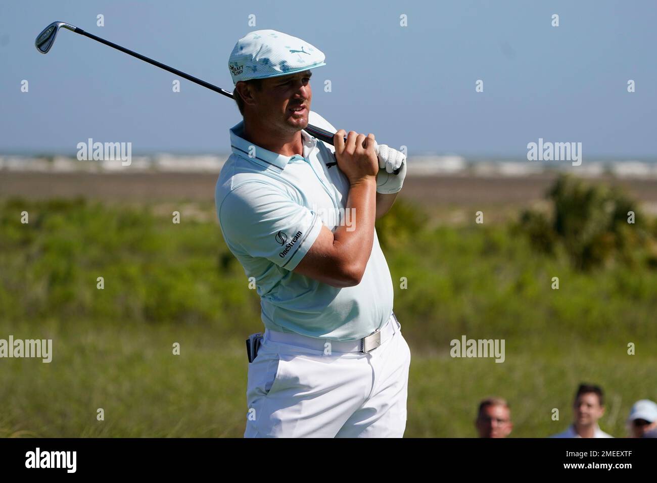 Bryson DeChambeau watches his tee shot on the eighth hole during the ...