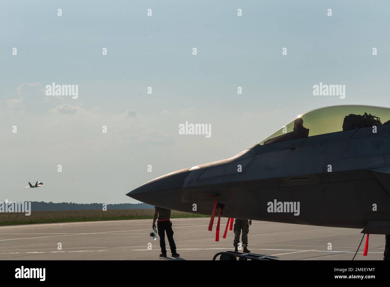 A U.S. Air Force F-22 Raptor assigned to the 90th Expeditionary Fighter ...