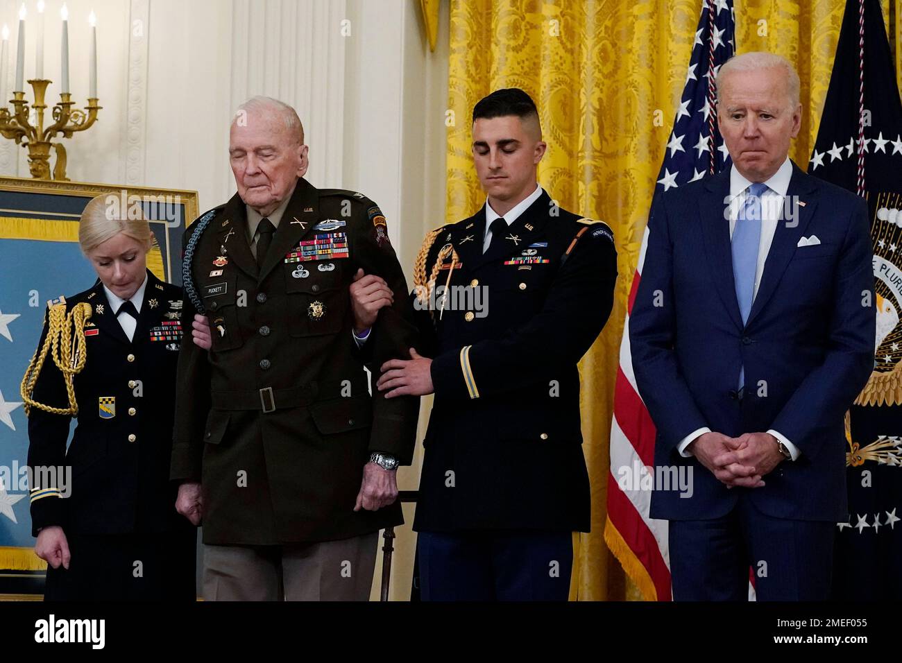 President Joe Biden and retired U.S. Army Col. Ralph Puckett, pray ...