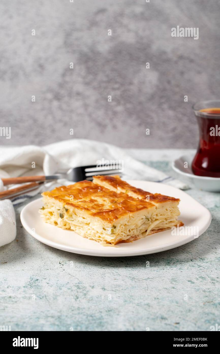 Turkish Su Boregi or Tabla borek with cheese. Turkish Patty on stone ...
