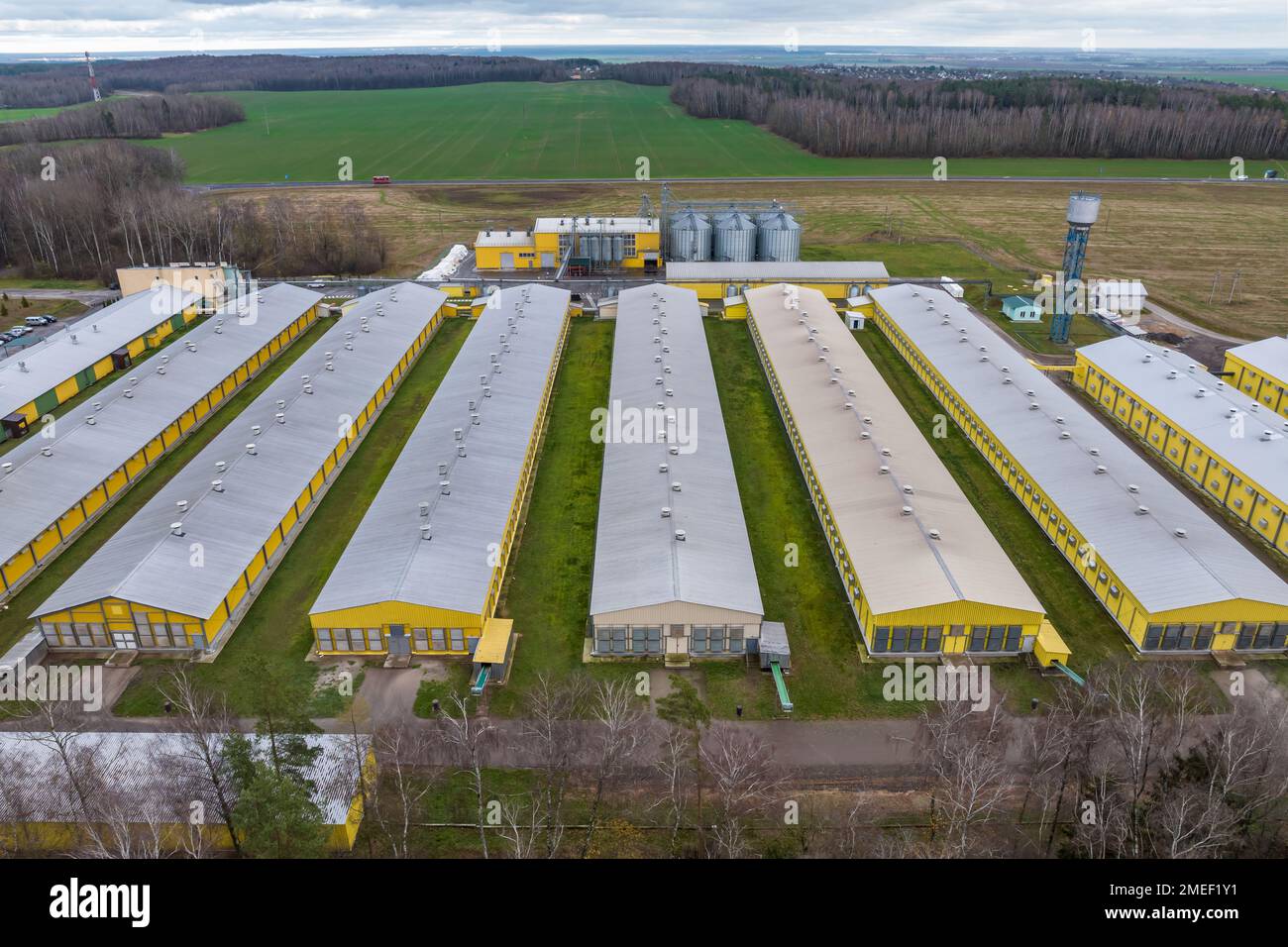aerial view of rows of agro farms with silos and agro-industrial ...