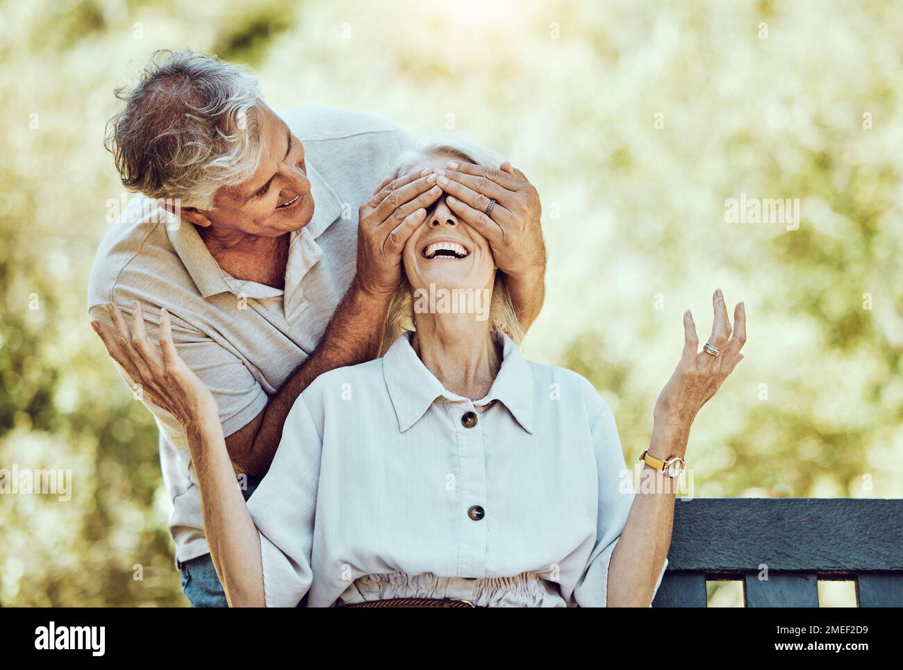 Retirement, love and surprise with a senior man covering the eyes of ...