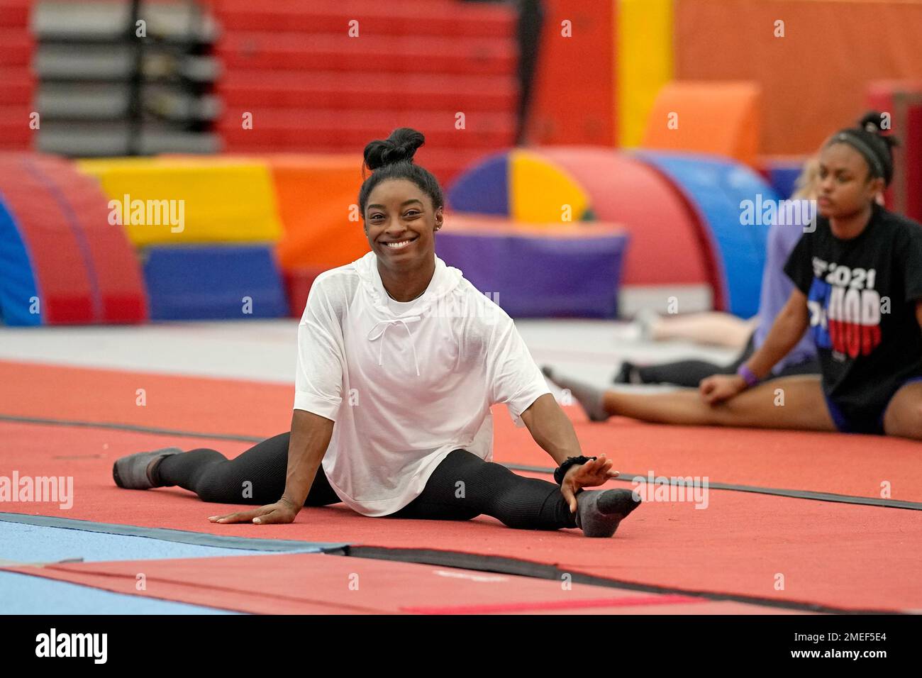 Reigning Olympic champion gymnast Simone Biles stretches during a ...
