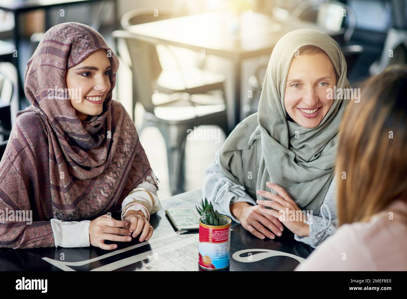 They grow closer with every get together. a group of women chatting in ...